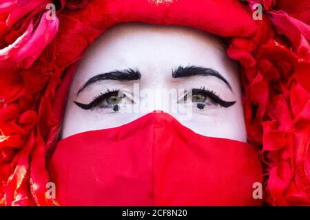 Portrait of a red-robed protester during Extinction Rebellion ...