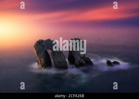 Beautiful view of a calm sea under a sunset sky Stock Photo - Alamy