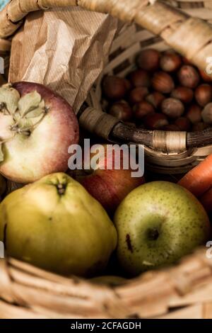 Composition with vegetables and fruits in wicker basket isolated on ...