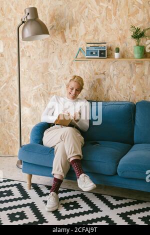 Cheerful blonde female working in laboratory Stock Photo - Alamy