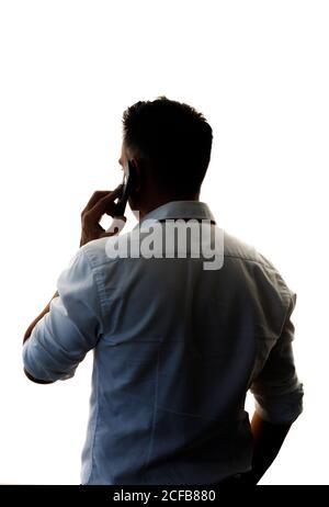 Businessman talking on mobile phone in city Stock Photo - Alamy