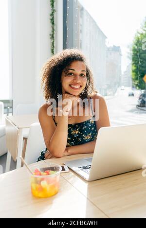 Freelancer woman in a summer cafe doing remote work Stock Photo - Alamy