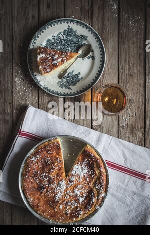 From above cottage cheese baked pudding served on plate and glass of ...