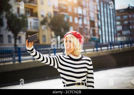 Photo of funny short hairstyle young lady show okey wear shirt jeans ...