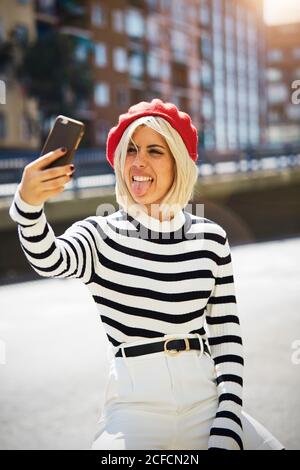 Photo of funny short hairstyle young lady show okey wear shirt jeans ...