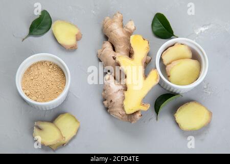 Ginger powder and fresh root, top view Stock Photo - Alamy