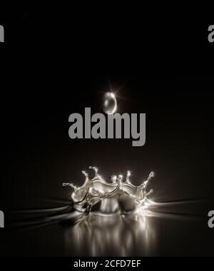 coloured liquid splashing in floating glasses Stock Photo - Alamy