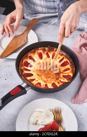 Female hand with tasty coconut pie on wooden background Stock Photo - Alamy