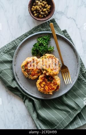 Grilled fish cutlets on metal plate Stock Photo - Alamy