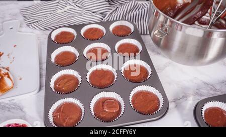Step by step. Scooping cupcake batter into foil cupcake cups to bake ...