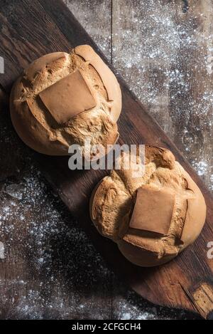 A top view of bread loaves covered in sesame seeds and peanuts Stock ...