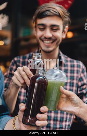 Happy friends having a drink together Stock Photo - Alamy