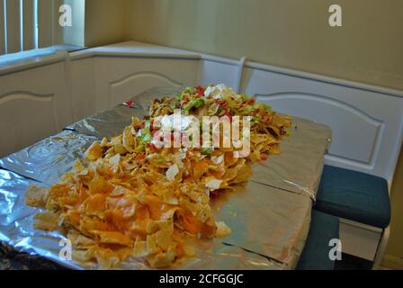 Nacho table kitchen table wrapped in aluminum foil and covered with ...