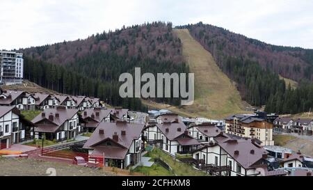 Bukovel ski resort in autumn aerial view. View of hotel houses in the ...