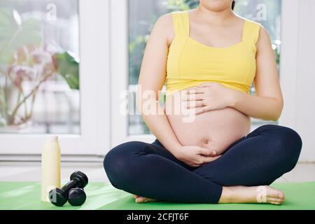 Pregnancy, yoga, people and healthy lifestyle concept - happy pregnant ...