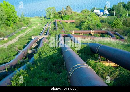sewer pipes on a hillside draining waste Stock Photo - Alamy