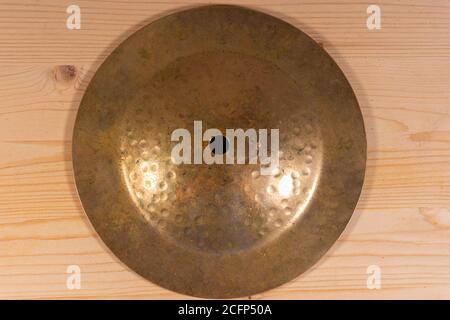 Close up of a bronze musical cymbal. Concept of metal processing Stock ...