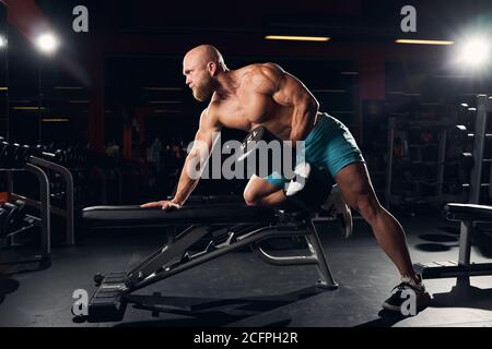 Sporty bald man working out in the gym Stock Photo - Alamy