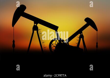 Oil pumps at sunset Stock Photo - Alamy