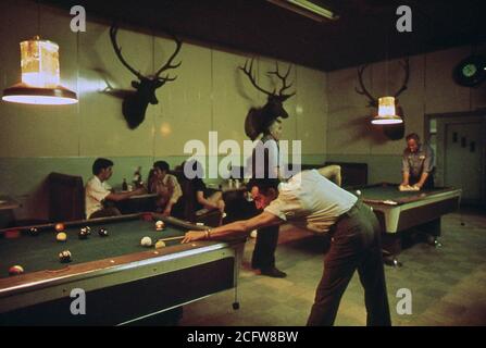 early 1970s pool hall men playing pool and drinking beer Stock Photo ...