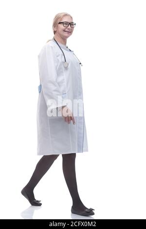 side view. experienced female doctor stepping forward. isolated on a ...
