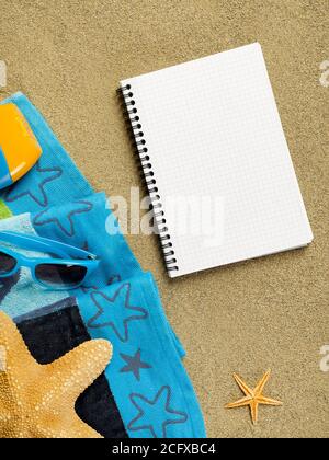 Blank writing book with summer beach accessories on background, copy ...