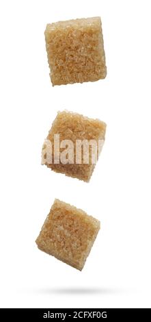 Cubes of brown sugar falling on white background Stock Photo - Alamy