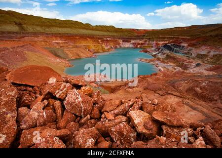 Colors of aluminium ore quarry. Bauxite open cast (open cut) mining ...