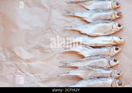 Dried fishes template banner on craft paper background with empty space ...