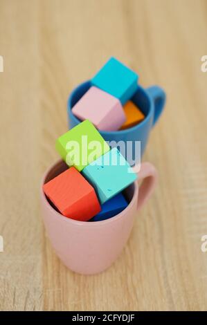 Colorful wooden blocks in cups Stock Photo - Alamy