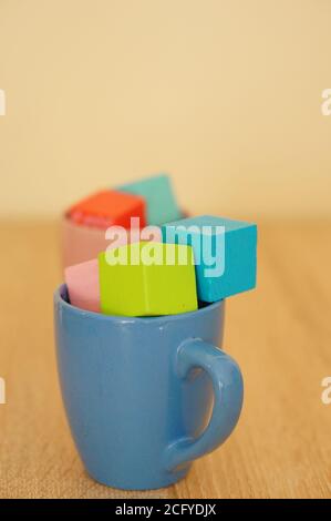 Colorful wooden blocks in cups Stock Photo - Alamy