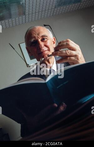 Sir Ron Dearing with the first draft copies of his NCC interim report ...