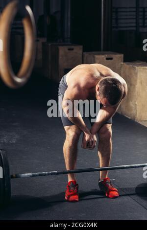 Beautiful bodybuilder figure in a dark vein underlined muscle. On a ...