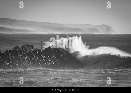Big ocean wave hitting pier. Storm waves Stock Photo - Alamy