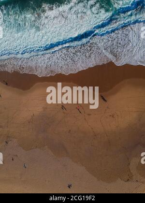 A beautiful shot of white sandy beach with seascape under blue sky ...