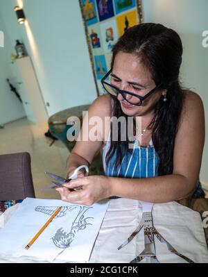 Middle age hispanic woman tailor smiling confident standing with arms ...