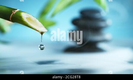 Dripping drops from bamboo tube, spa and wellness concept Stock Photo ...