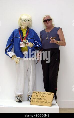 TOP OF THE POPS DJ Jimmy Saville with Mickey Dolenz of the Monkees and ...