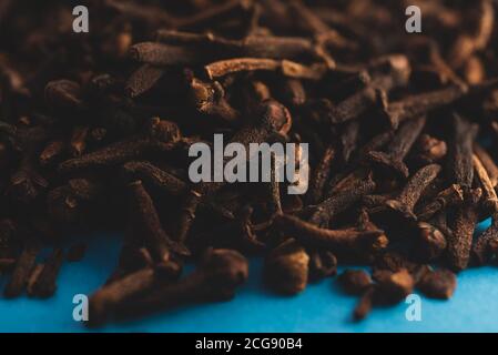 Clove Macro potograph, on blue background Stock Photo - Alamy