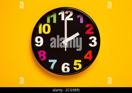 Wall clock show two o'clock on marble texture. Office clock show 2pm or ...