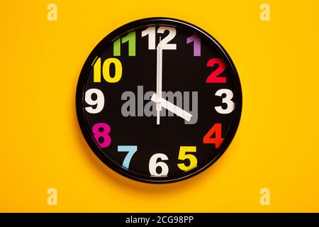 Wall clock show four o'clock on white marble texture. Office clock show ...