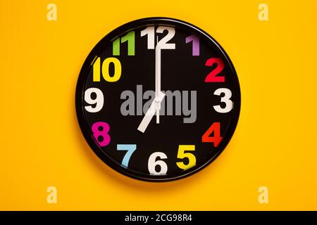 Wall clock show seven o'clock on marble texture. Office clock show 7pm ...