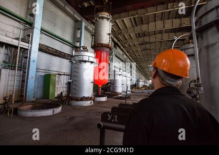 Titanium metallurgy. Melting of titanium in vacuum furnace Stock Photo ...