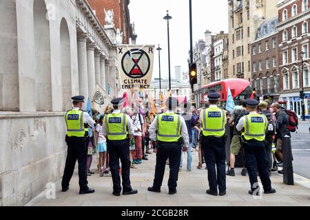Police stopping a group of protesters in Whitehall near Downing Street ...