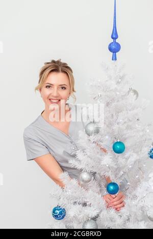 Successful young woman cosmetologist on background beauty office ...