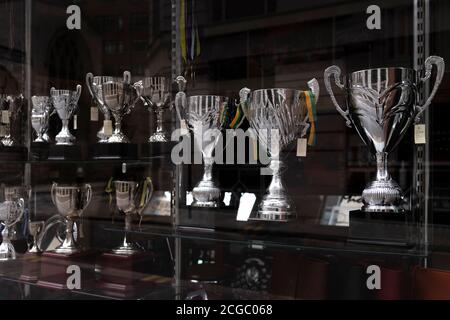 Trophies in a shop window Stock Photo - Alamy