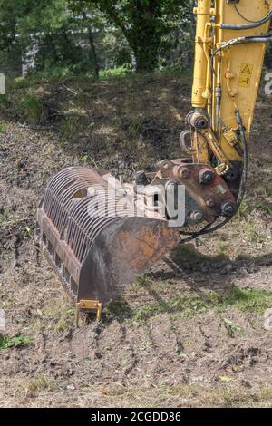 Special weed cutting dredge bucket attachment on small excavator. Used ...
