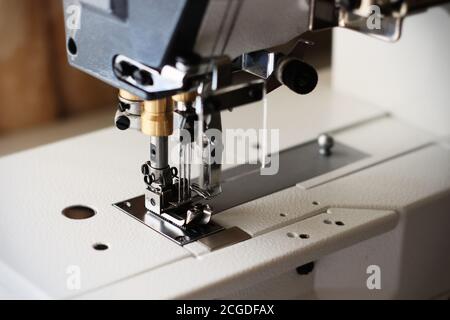 Industrial flat-seam sewing machine. Close-up. Soft focus Stock Photo ...