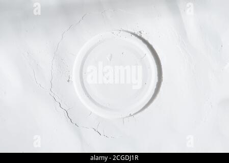 Decorative round frame from white powder, flour or grinded chalk on a ...