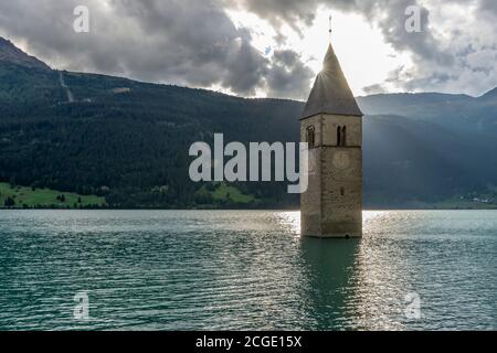 bell tower of the submerged church in the lake of resia in trentino ...
